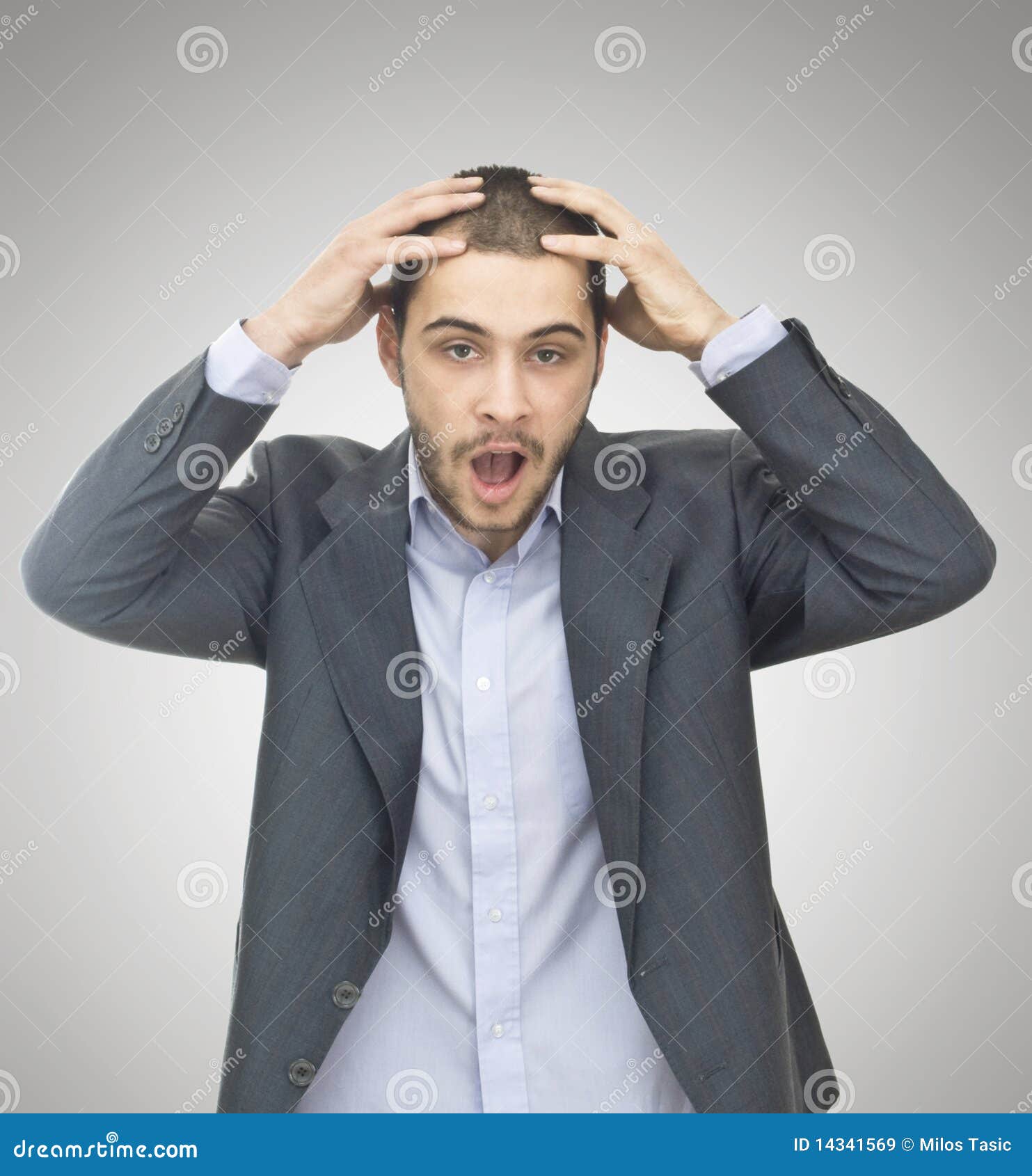 Surprised Young Businessman Stock Image - Image of modern, human: 14341569