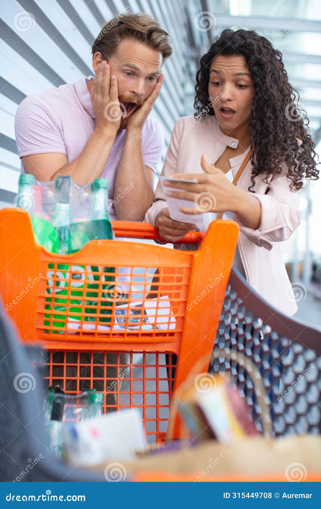 Surprised Young Couple Worried about Prices Stock Photo - Image of ...