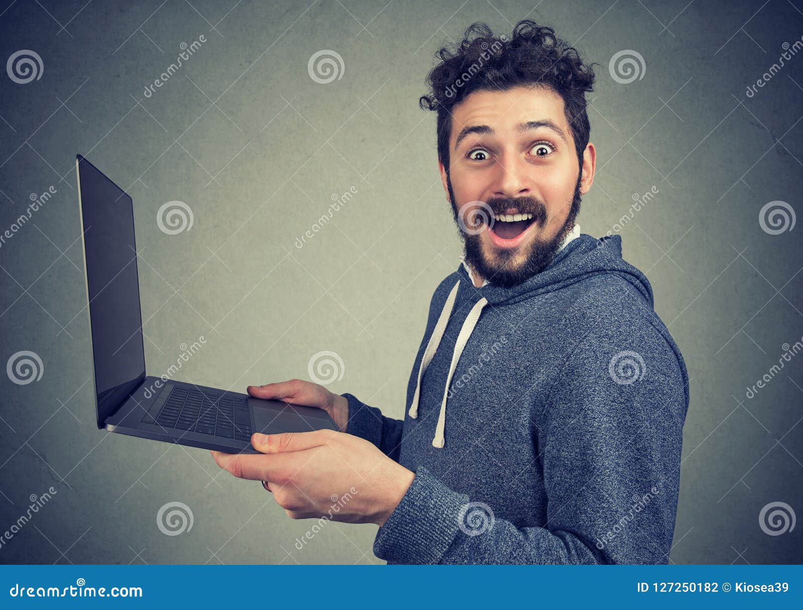 Surprised Young Man with Laptop Computer Looking at Camera Stock Photo ...