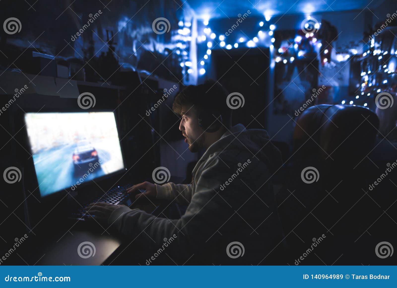 Surprised Young Man Playing Games on the Computer. a Man with a Beard ...