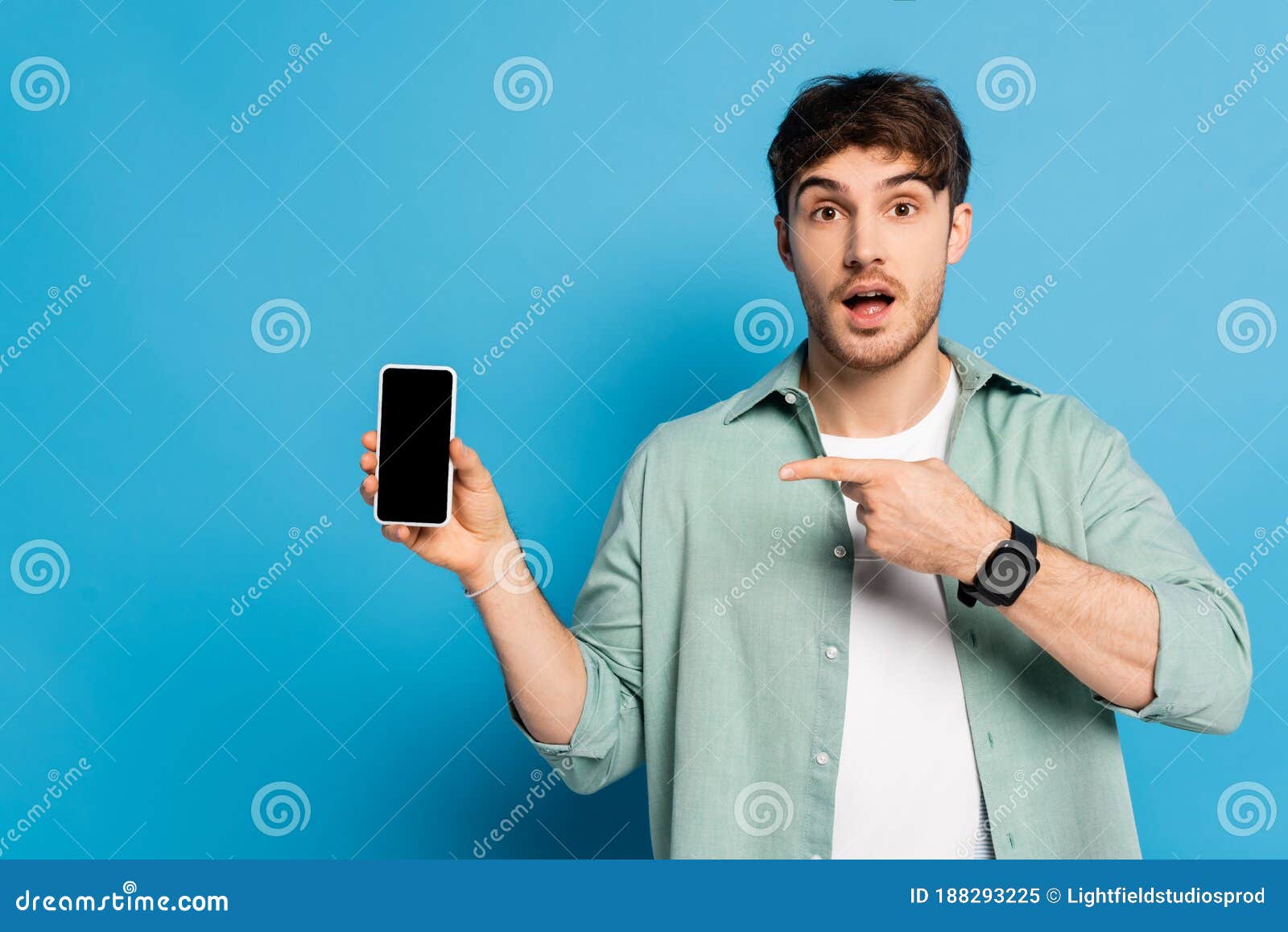 Young Man Pointing at Smartphone with Stock Image - Image of mobile ...