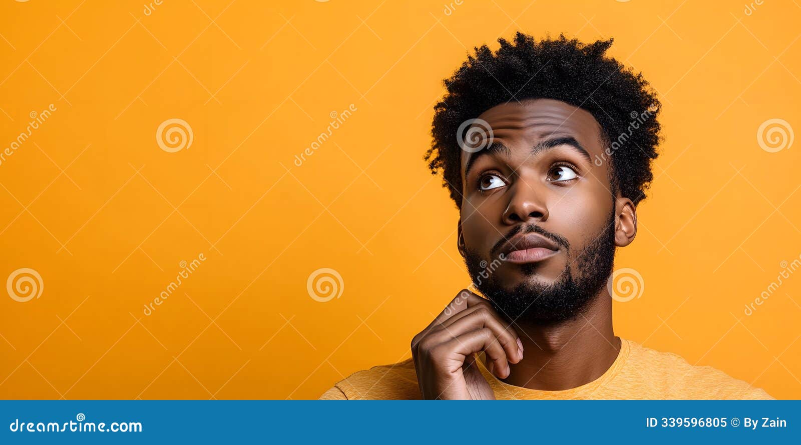 Surprised Young Man with Question Marks on Bright Orange Background ...