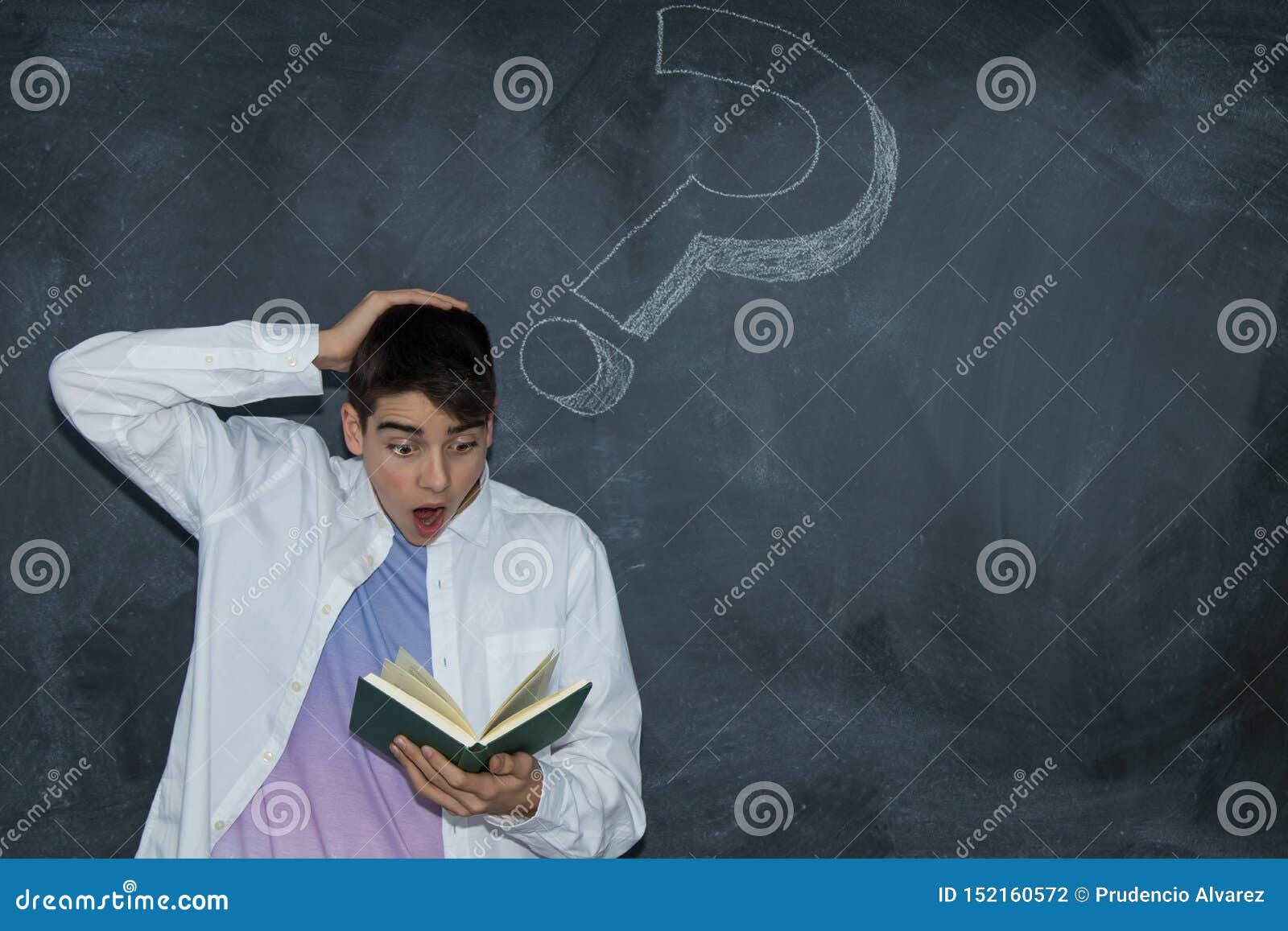 Surprised Young Man Reading the Book Stock Photo - Image of questioning ...
