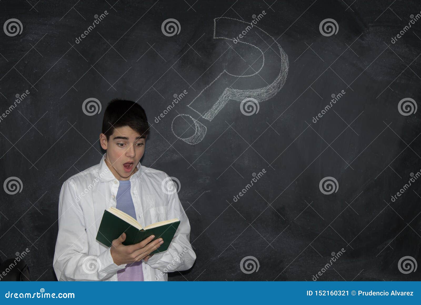 Surprised Young Man Reading Stock Image - Image of book, blackboard ...