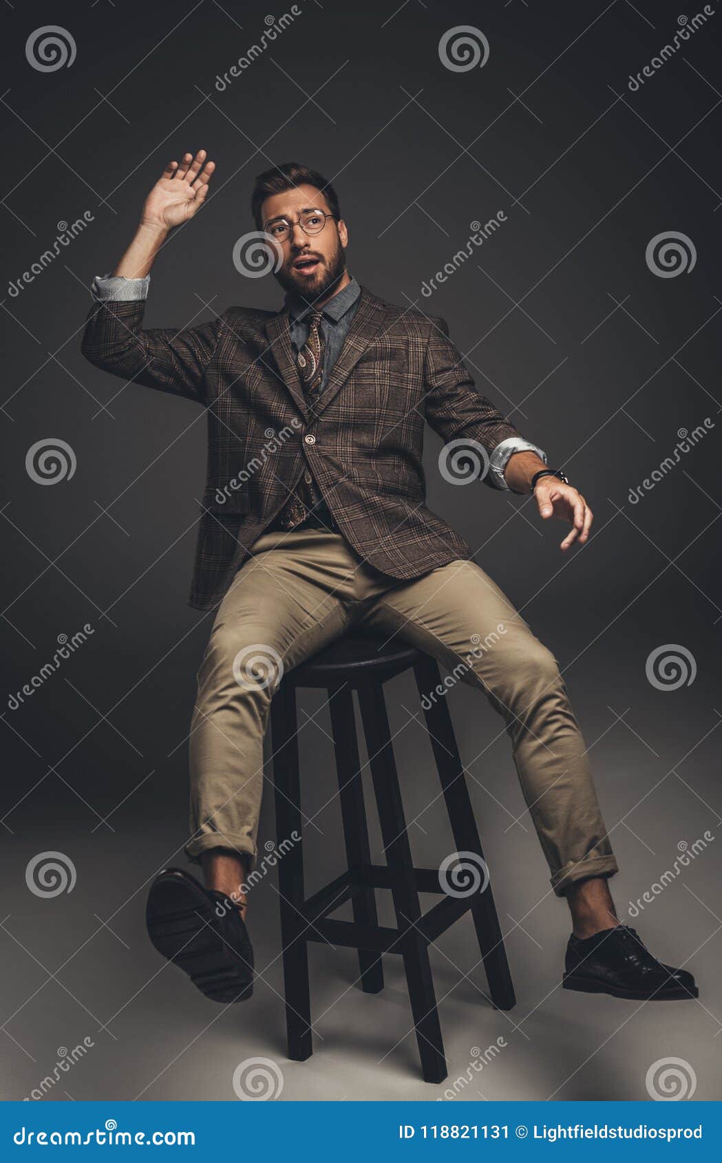 Surprised Young Man in Suit and Glasses Falling Backwards from a Stock ...