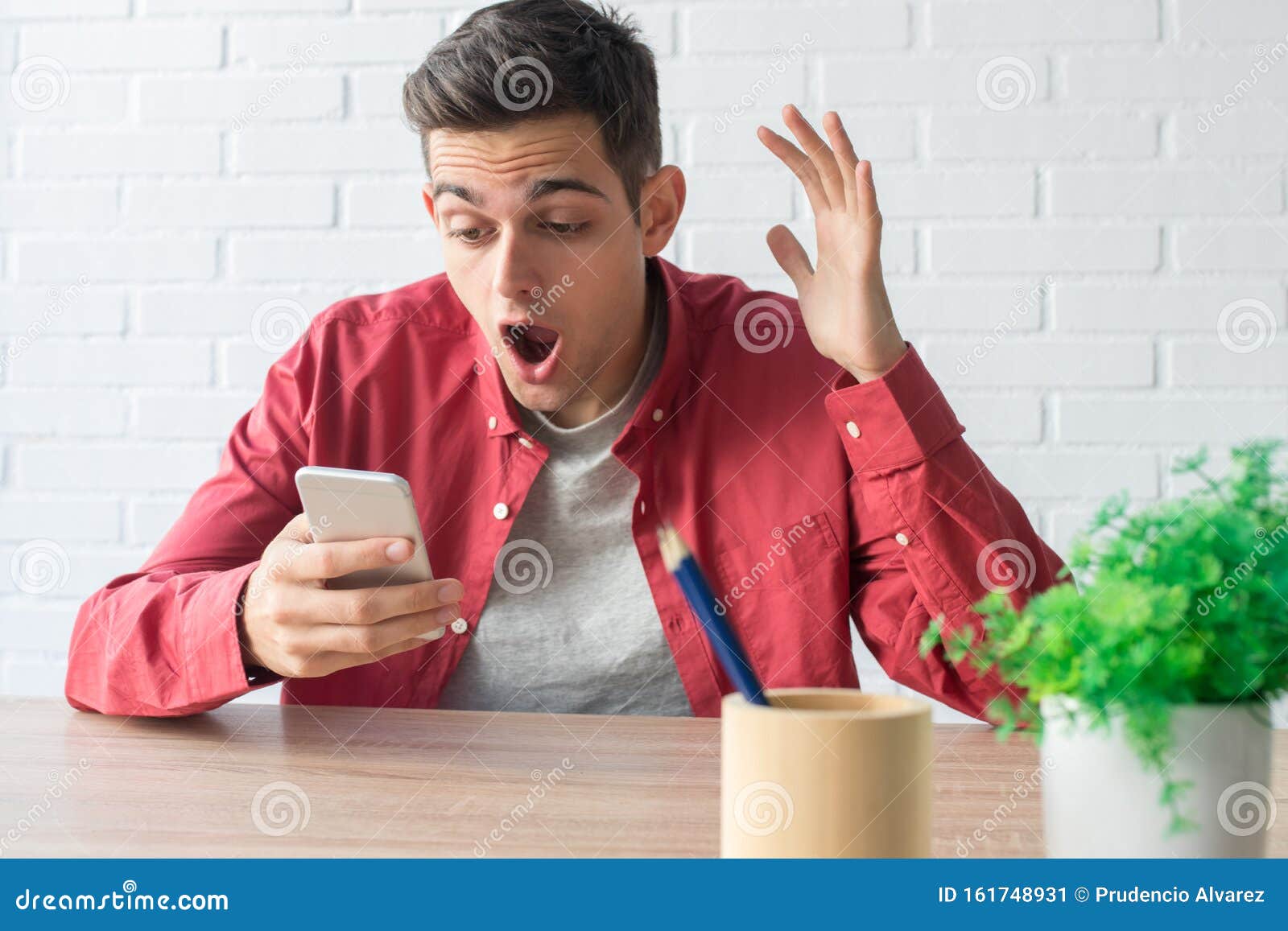 Surprised Young Man Watching Mobile Stock Image - Image of giveaway ...