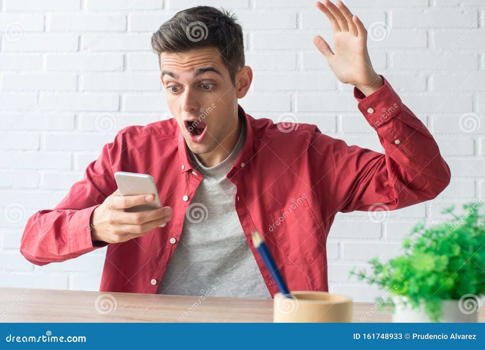 Surprised Young Man Watching Mobile Stock Image - Image of ...