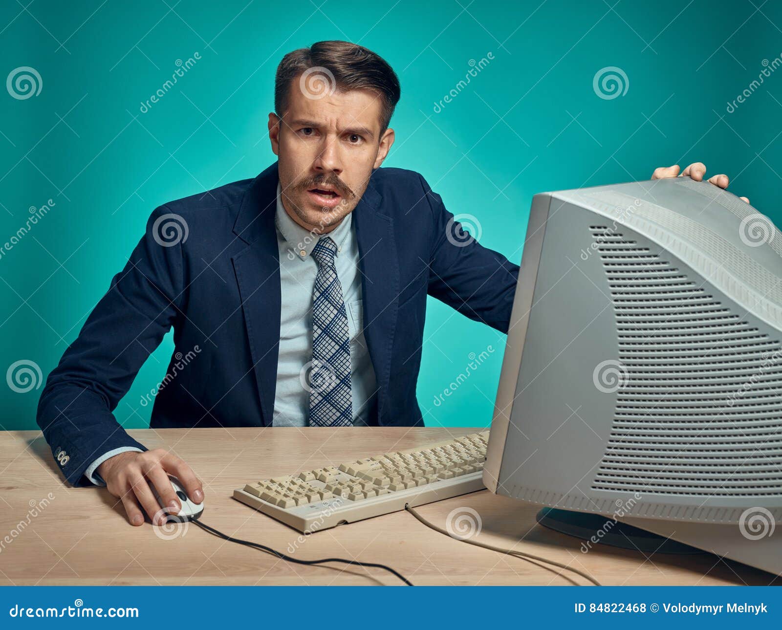 Surprised Young Man Working on Computer at Desk Stock Photo - Image of ...