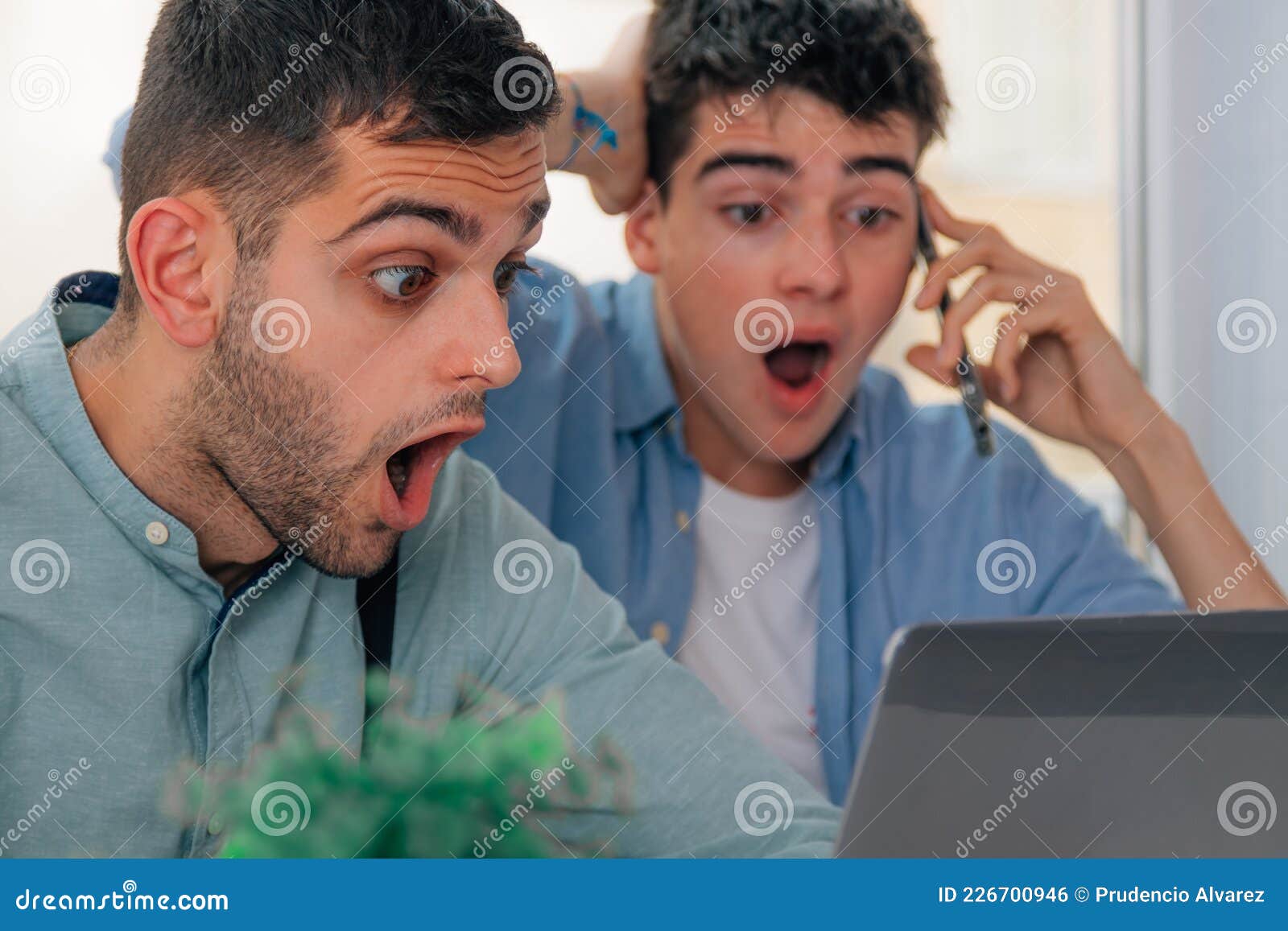 Surprised Young People Looking on the Internet Stock Photo - Image of ...
