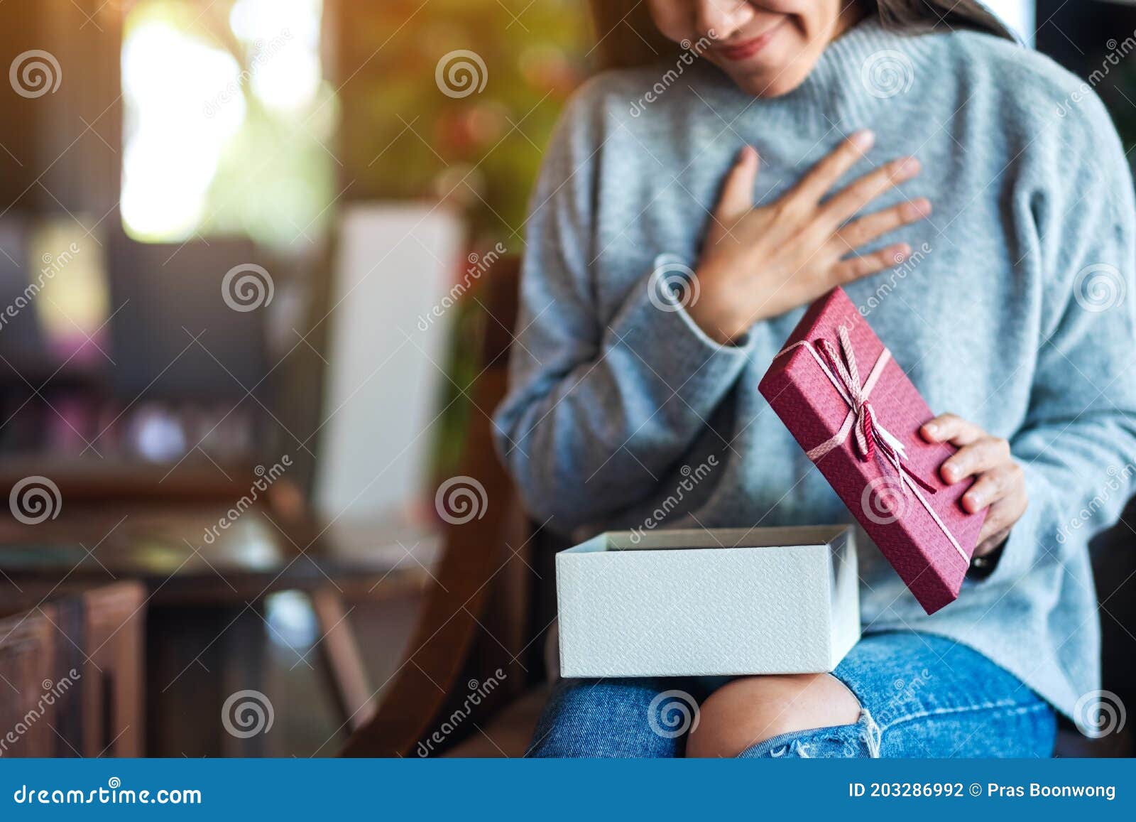 Surprised Woman Opening a Gift Box Stock Photo - Image of open, home ...