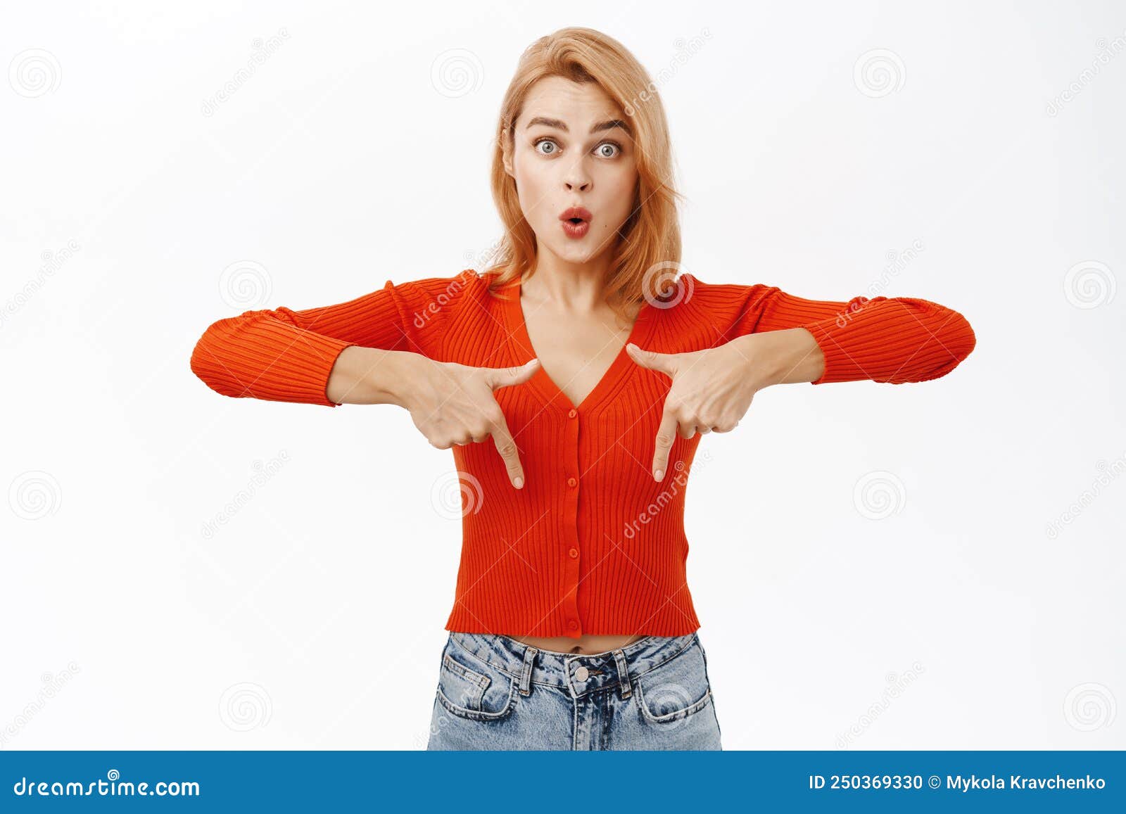 Surprised Young Woman Pointing Down, Showing Advertisement, Standing ...