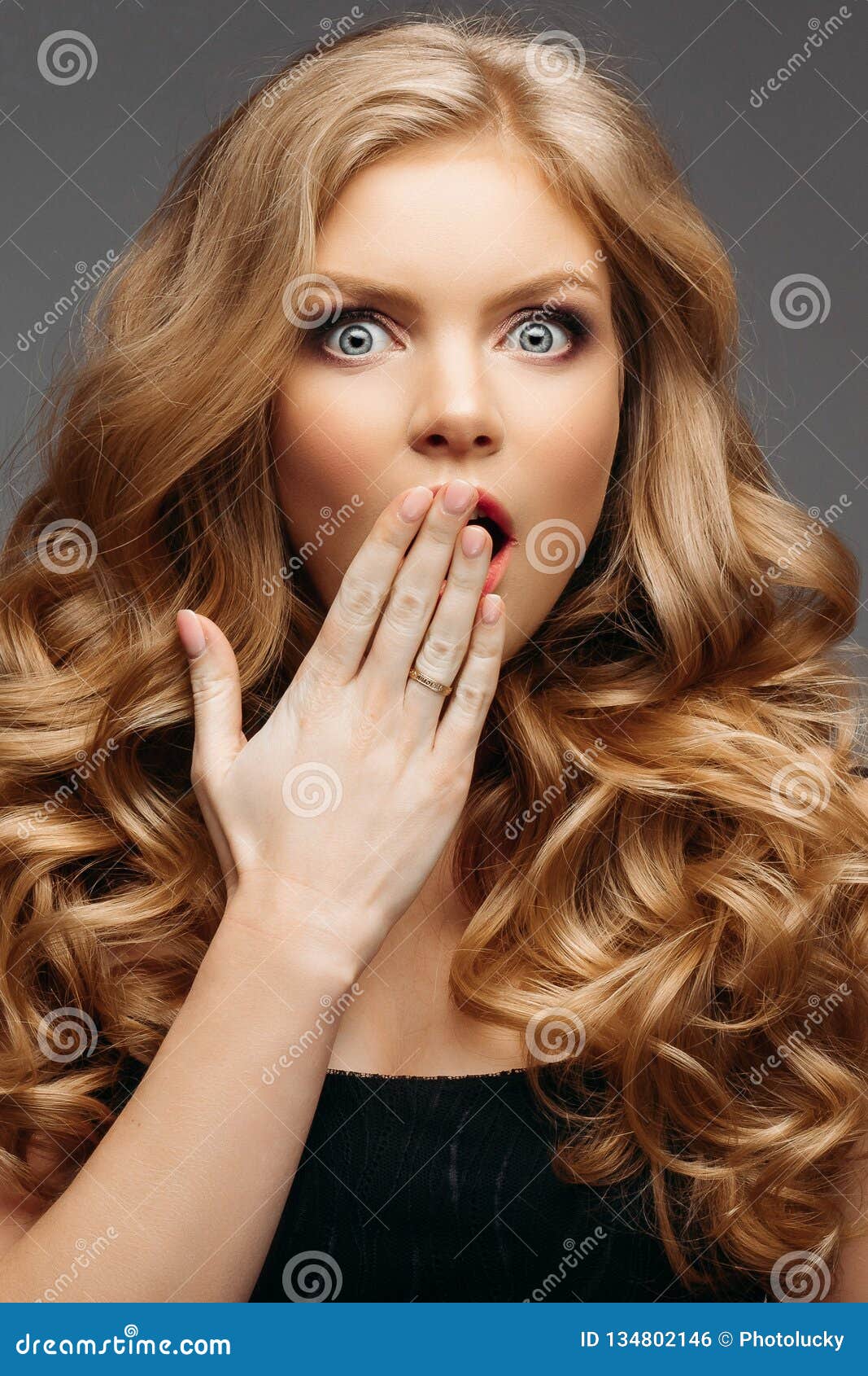 Surprised Young Woman Smiling in Studio Smiling Stock Photo - Image of ...