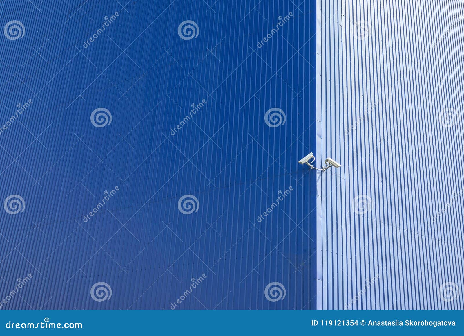 Surveillance Cameras on the Factory Blue Wall Stock Photo - Image of ...