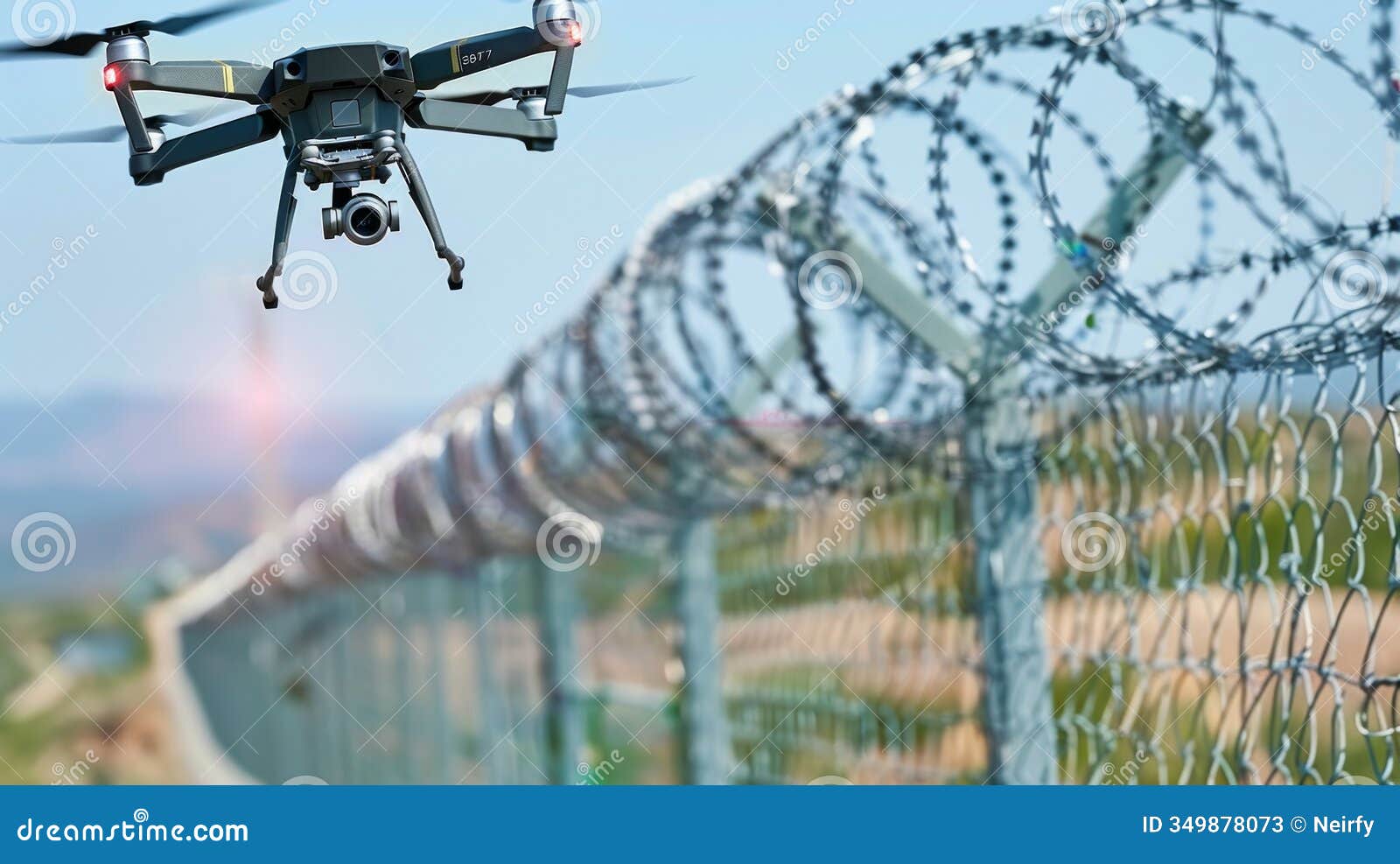 Surveillance Drone Flying Over Security Fence at Sunset, Employing ...