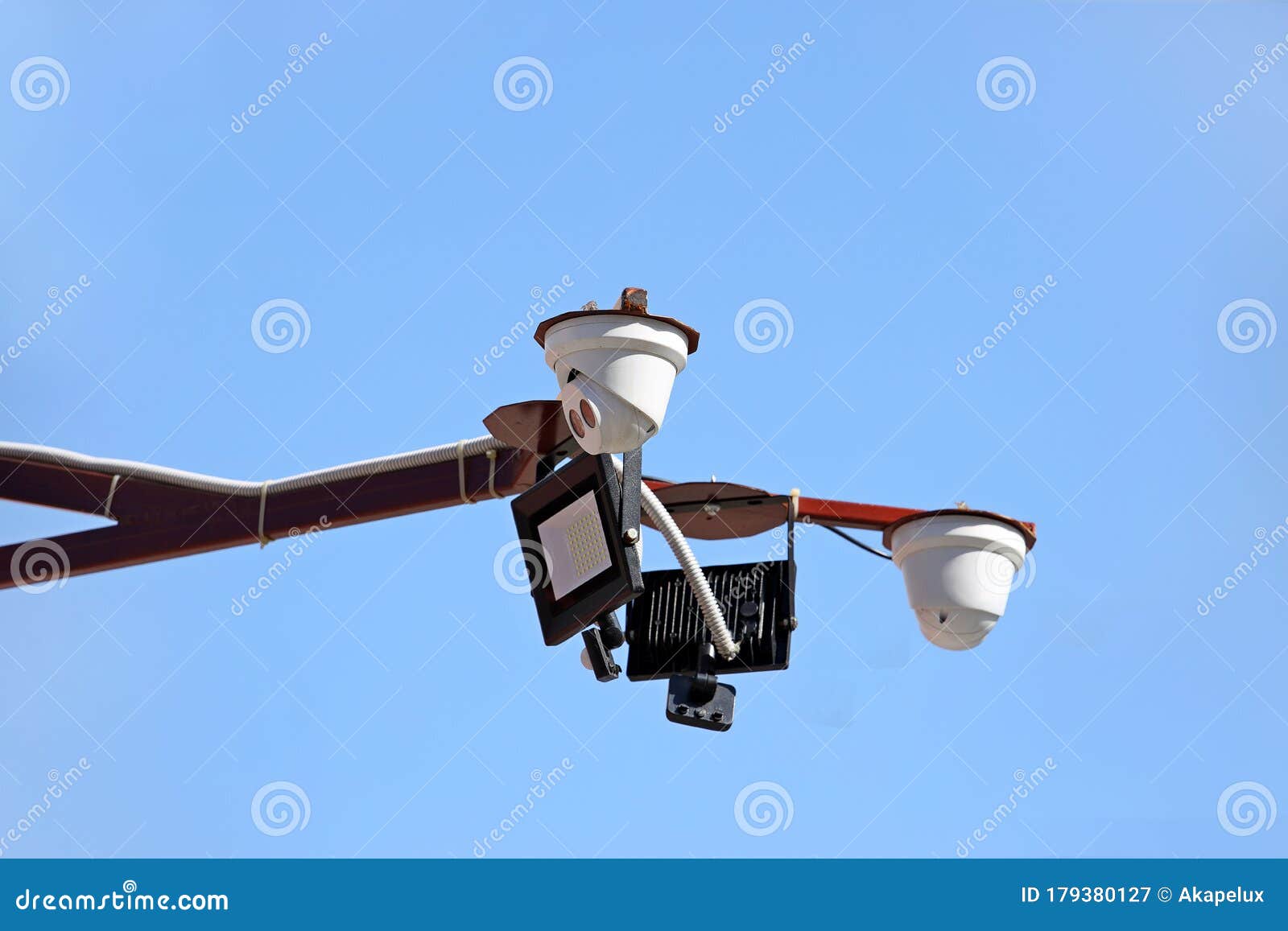 Surveillance System with an Orange Warning Light Located on a Pole in ...
