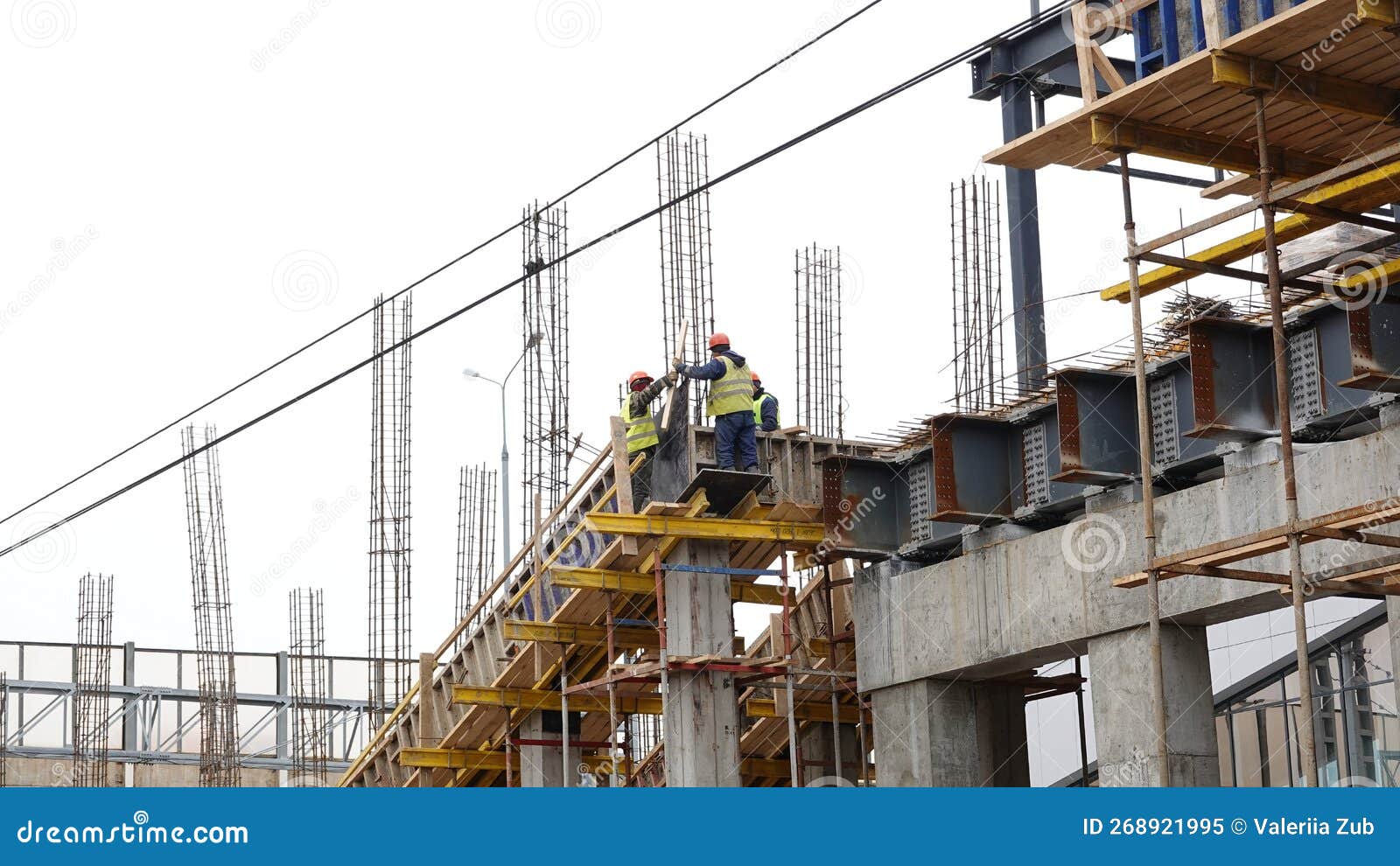 Builders at Construction Site Outdoors in Cloudy Weather Stock Image ...