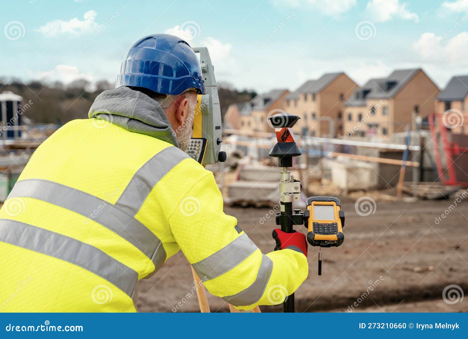 Surveyor Builder Site Engineer with Theodolite Total Station at Construction Site Outdoors ...