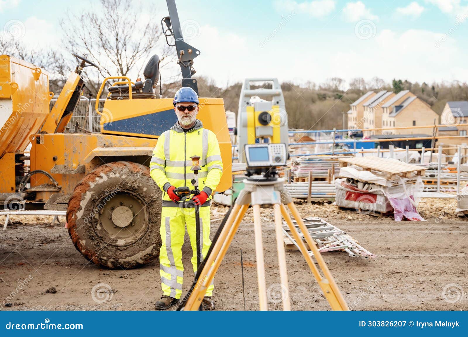 Surveyor Builder Site Engineer with Theodolite Total Station at Construction Site Outdoors ...