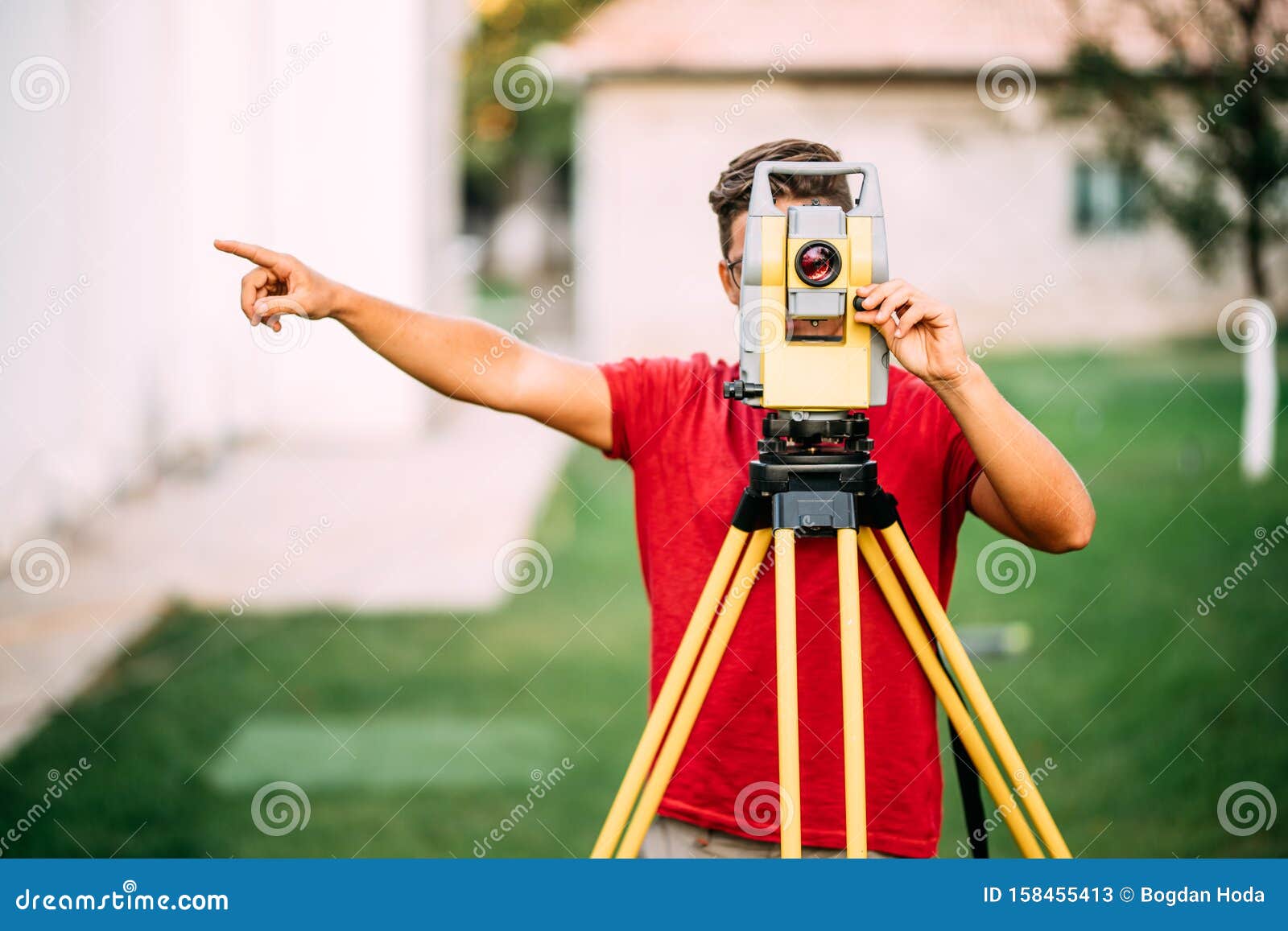 Cartographer Engineer, Surveyor Working With Total Station Construction ...