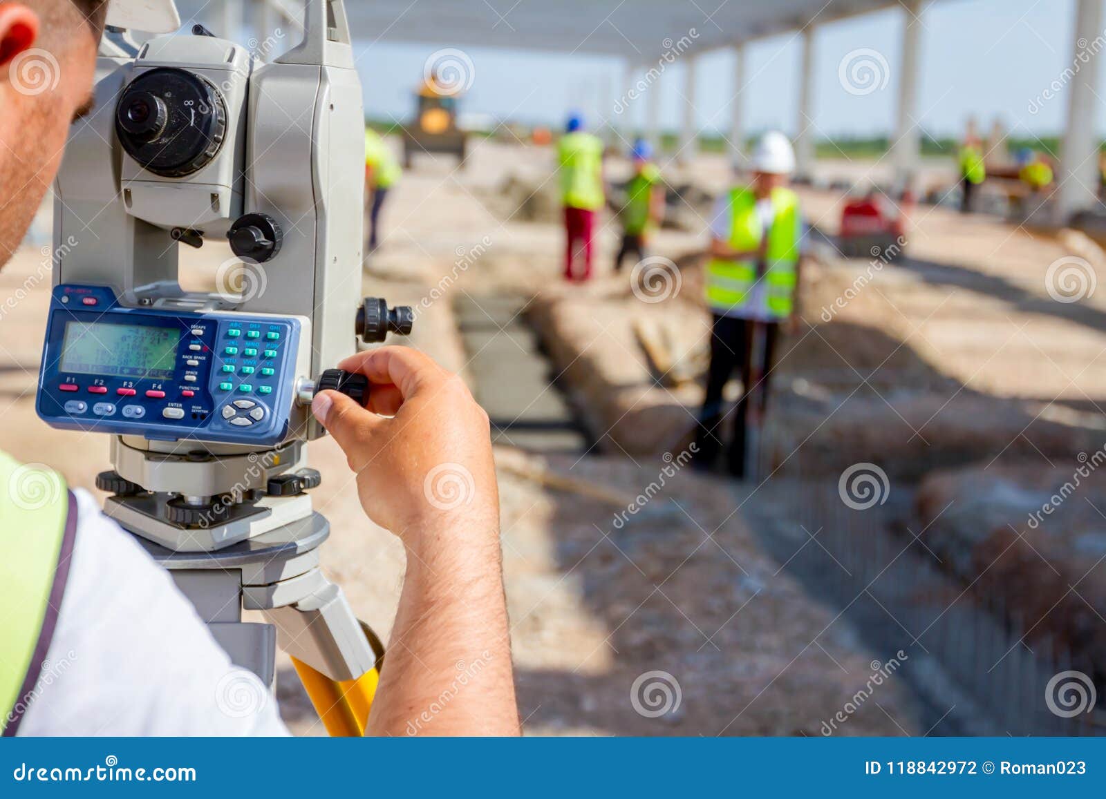 Civil Engineer, Geodesist is Working with Total Station on a Bui ...
