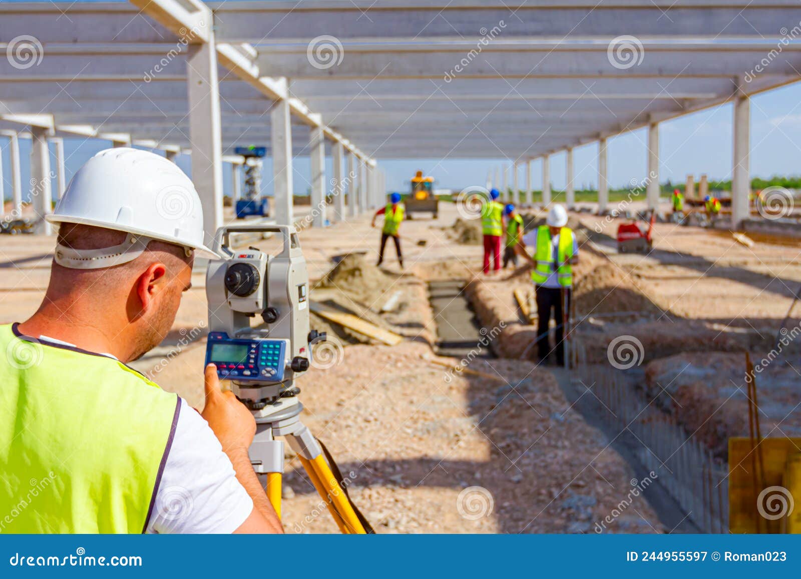 Civil Engineer, Geodesist is Working with Total Station on a Building ...