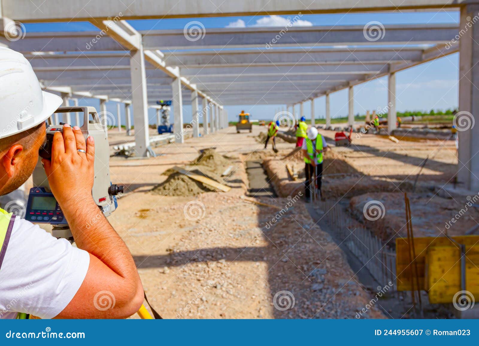 Geodesist Is Working With Total Station On A Building Site. Civil ...