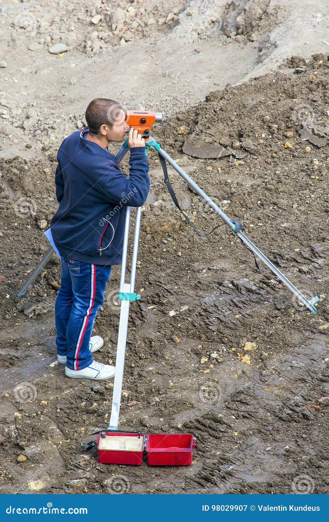 The Surveyor Makes Measurements with the Help of a Level. Workplace ...