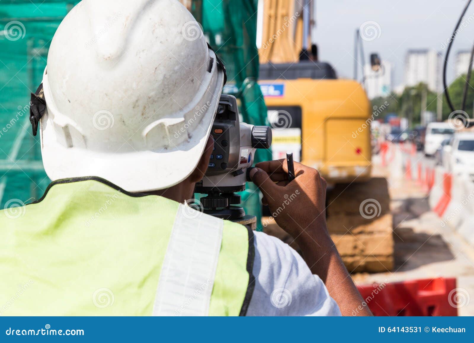 Surveyor Operating the Dumpy Automatic Level Instrument at Construction ...