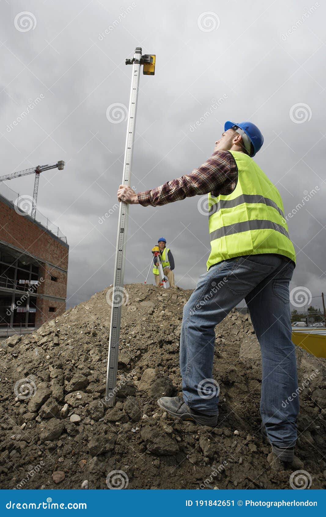 Surveyors Using Theodolite on Building Site Stock Image - Image of ...