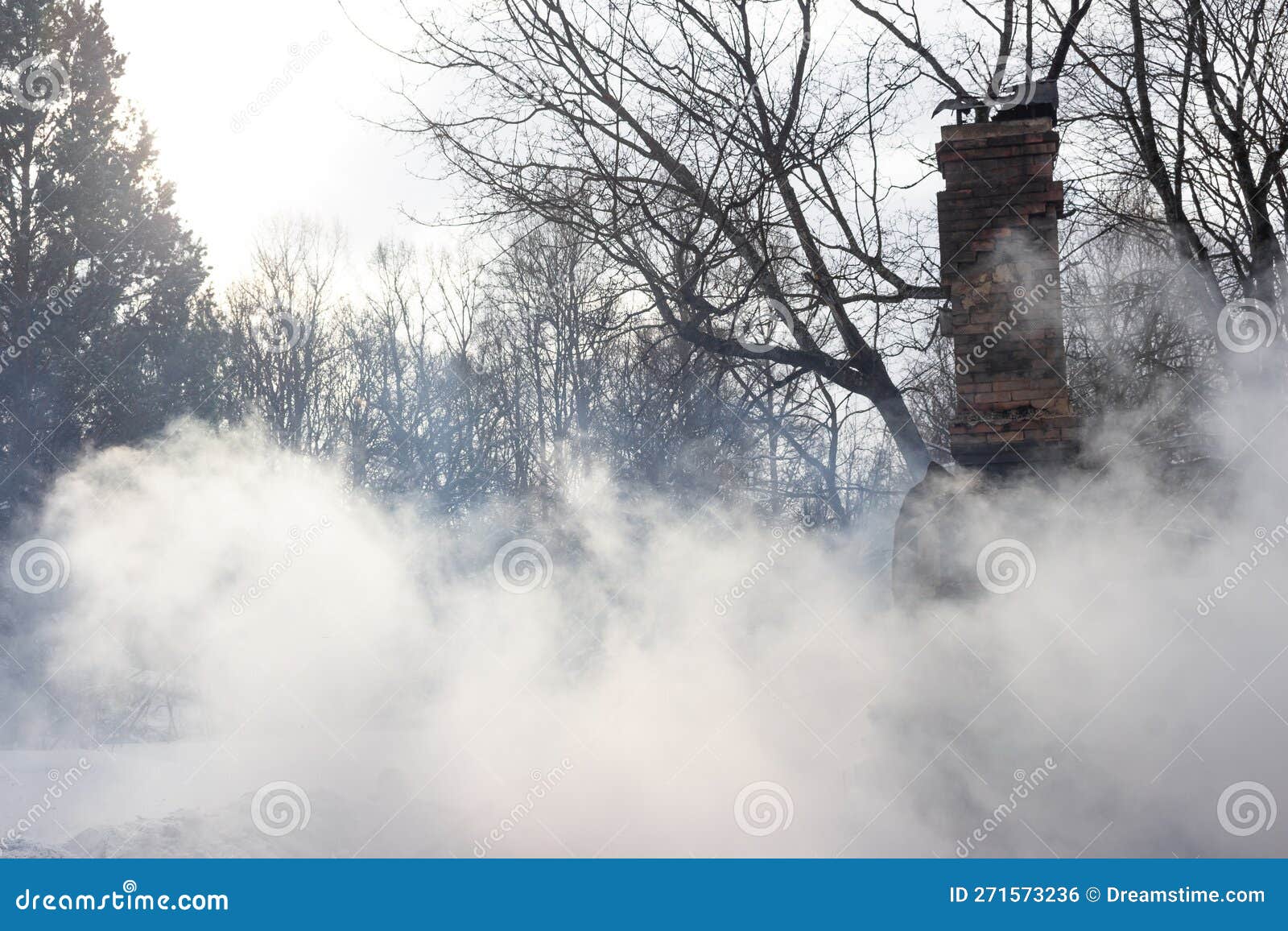 The Surviving Chimney Surrounded by Dense Smoke after a House Fire ...