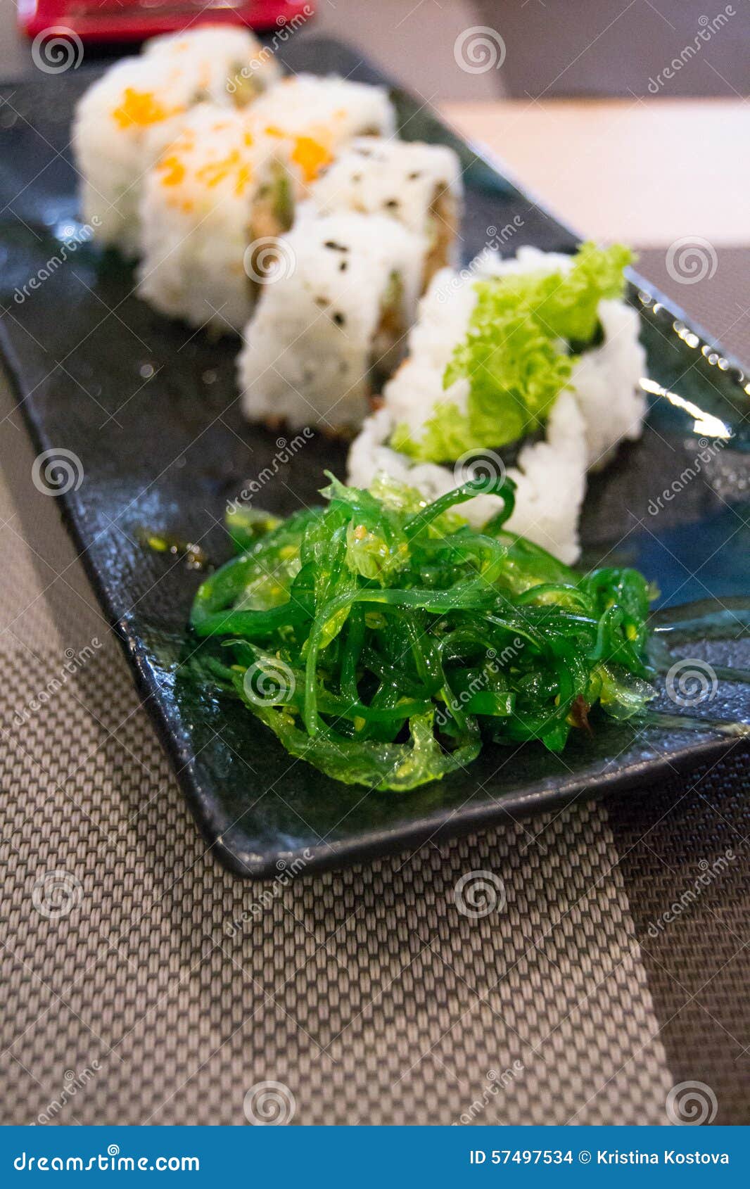Sushi and Algae Salad on a Plate in a Restaurant Stock Photo - Image of ...