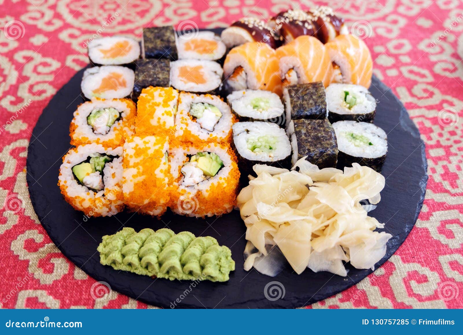 Sushi on a black plate stock image. Image of background - 130757285