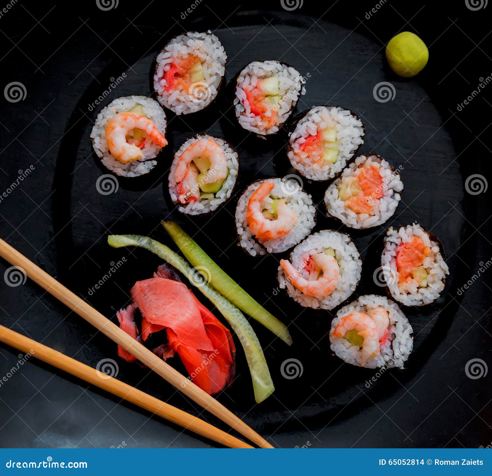 Sushi on a black plate stock photo. Image of healthy - 65052814