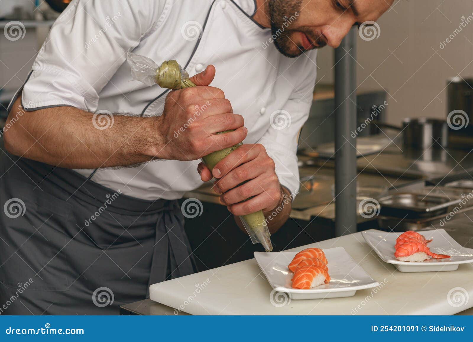 Sushi Master Prepares Sushi for Serving in Modern Commercial Kitchen ...