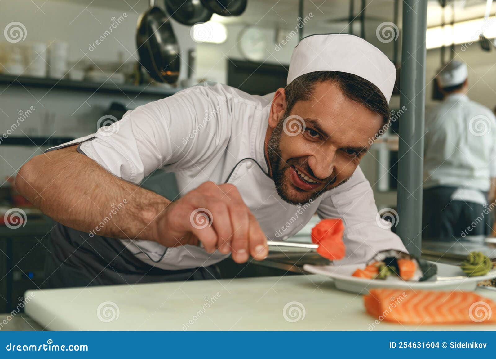 Sushi Master Prepares Sushi for Serving in Modern Commercial Kitchen ...