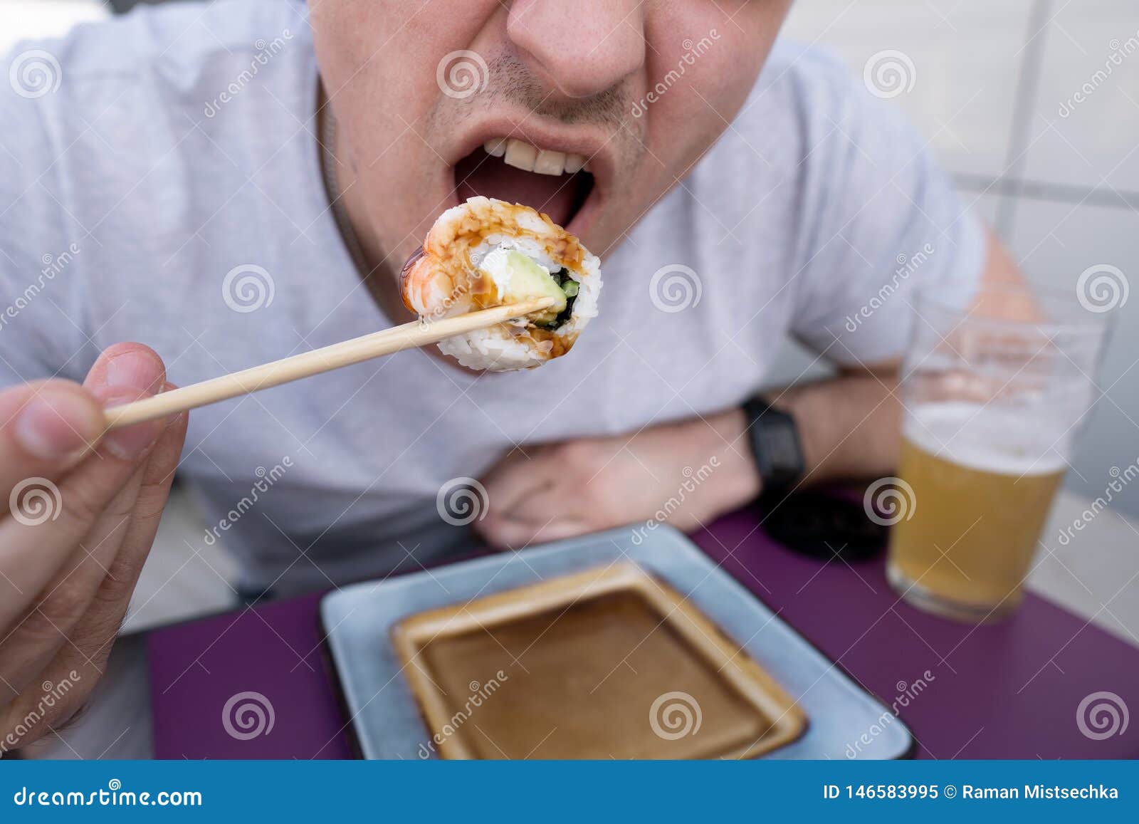 Sushi and Mouth Guy Closeup. the Guy Eats Sushi and Rolls with ...