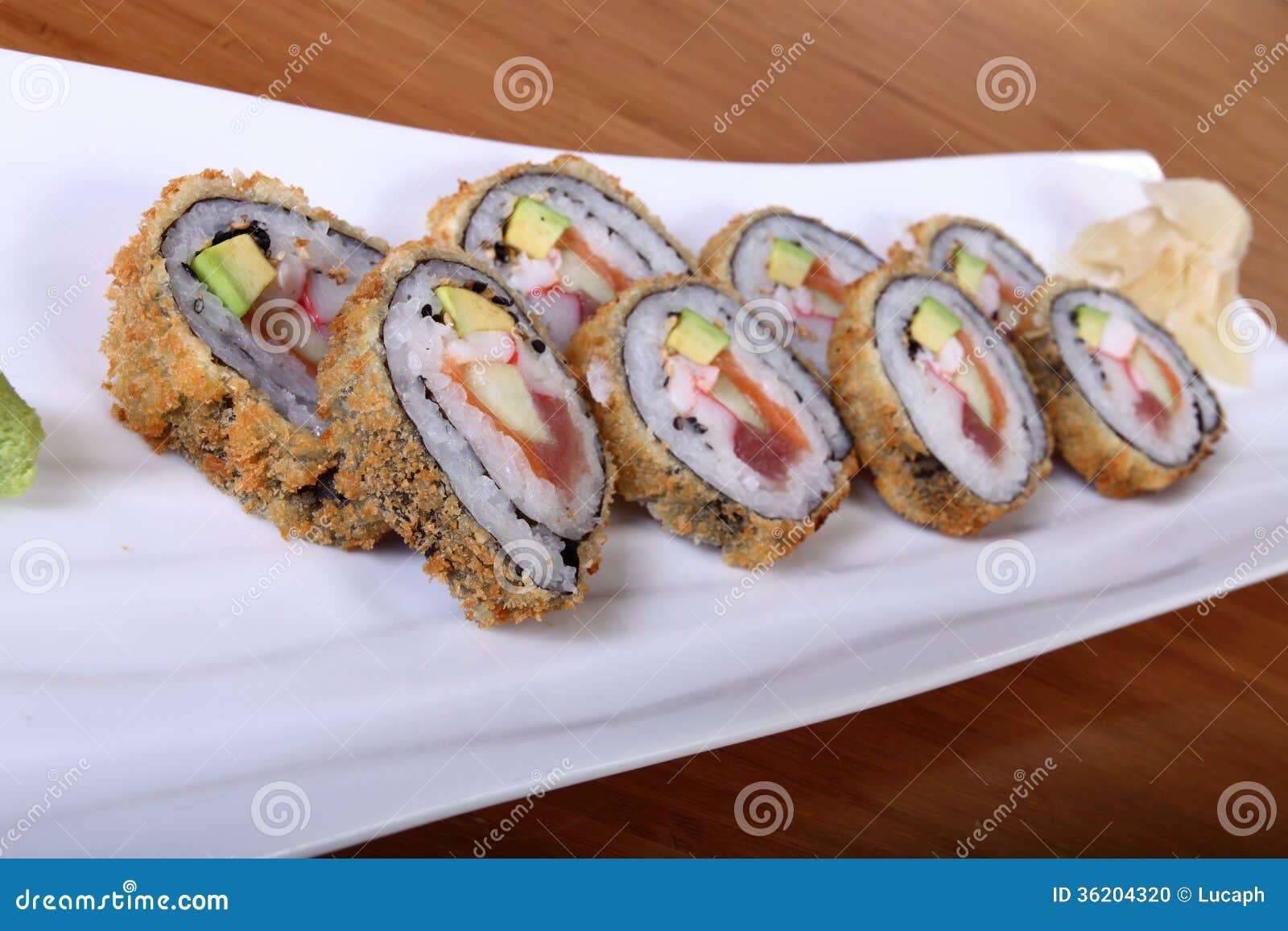 Sushi on rectangular plate stock photo. Image of meal - 36204320