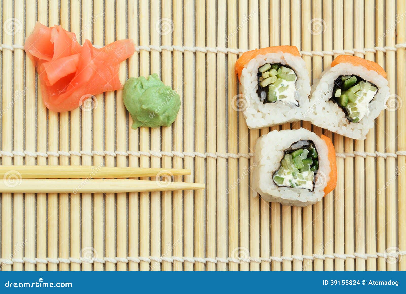 Sushi roll on bamboo mat stock photo. Image of cucumber - 39155824