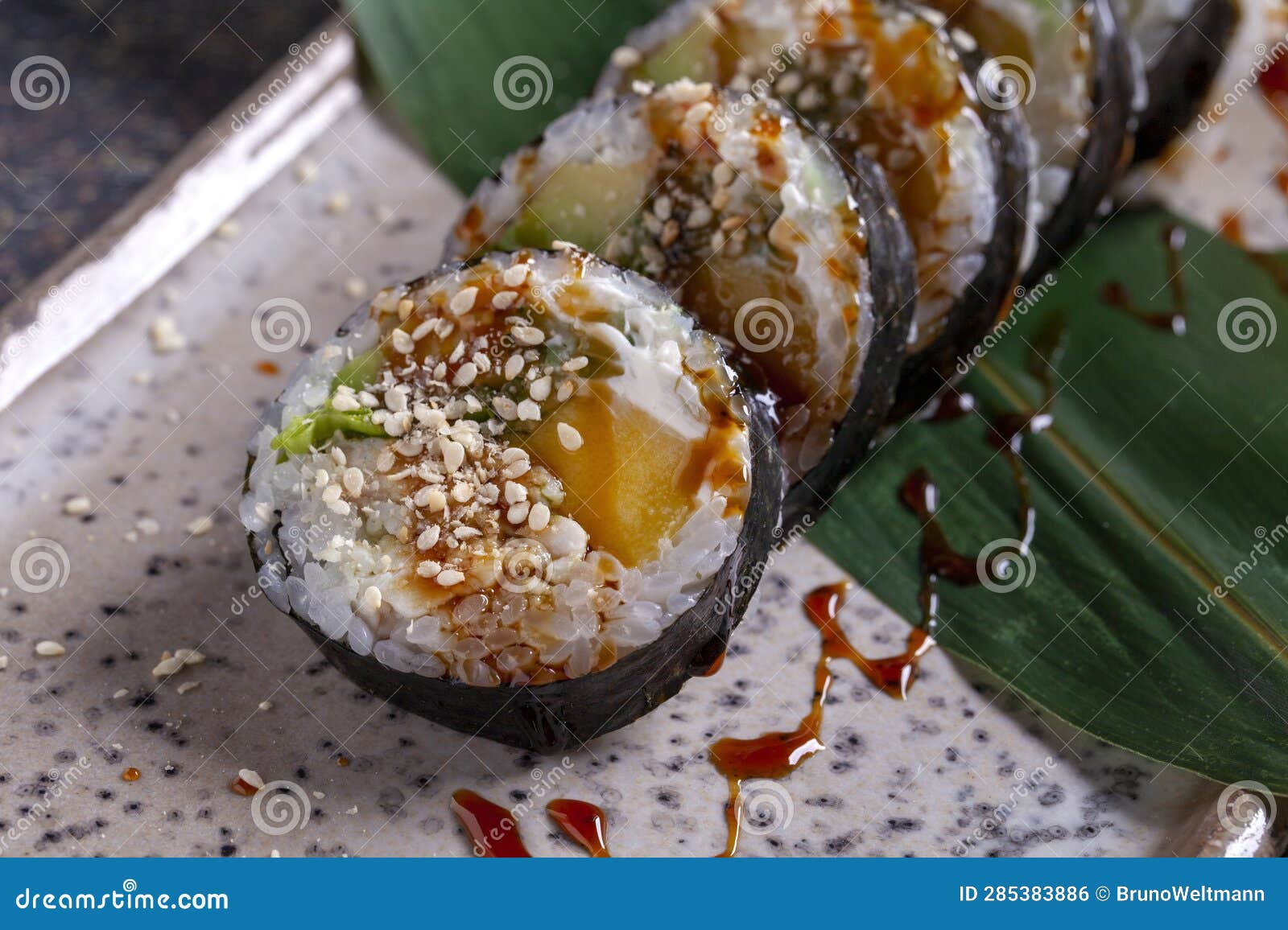 Sushi Roll with Eel, Nori, Cucumber and Sesame Seeds Stock Photo ...