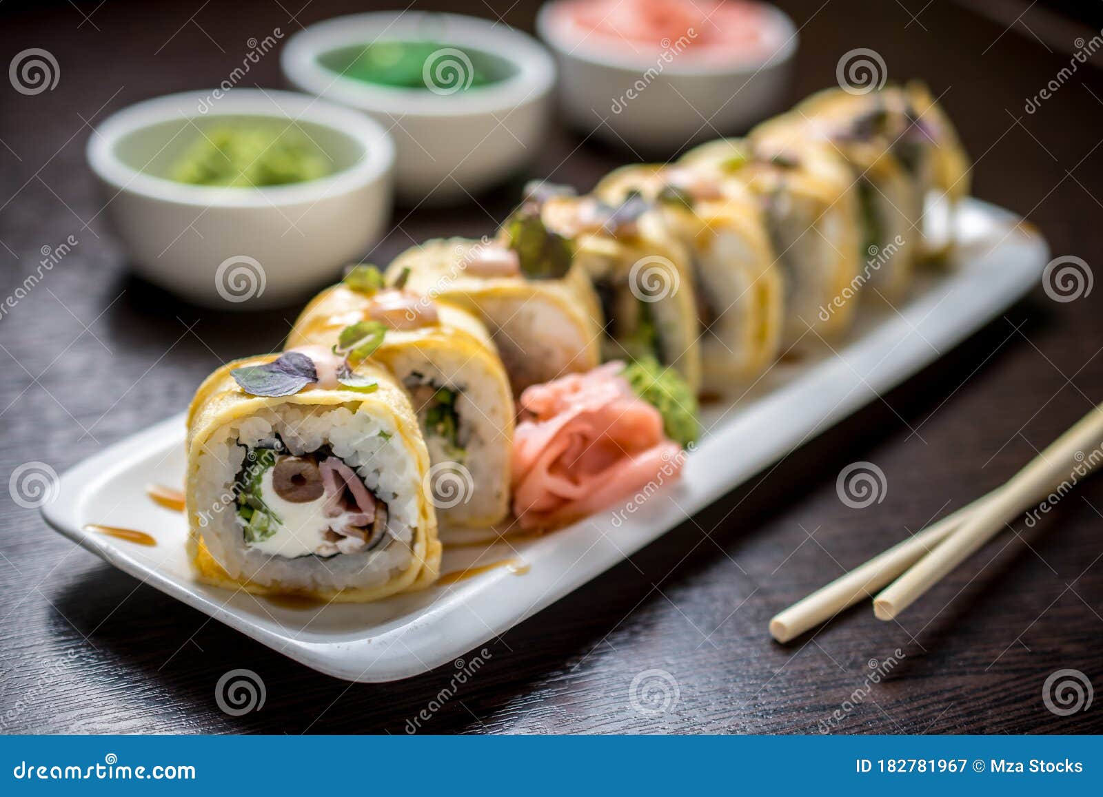 Sushi Rolls in an Omelet Around and Spring Onions Stock Image - Image ...