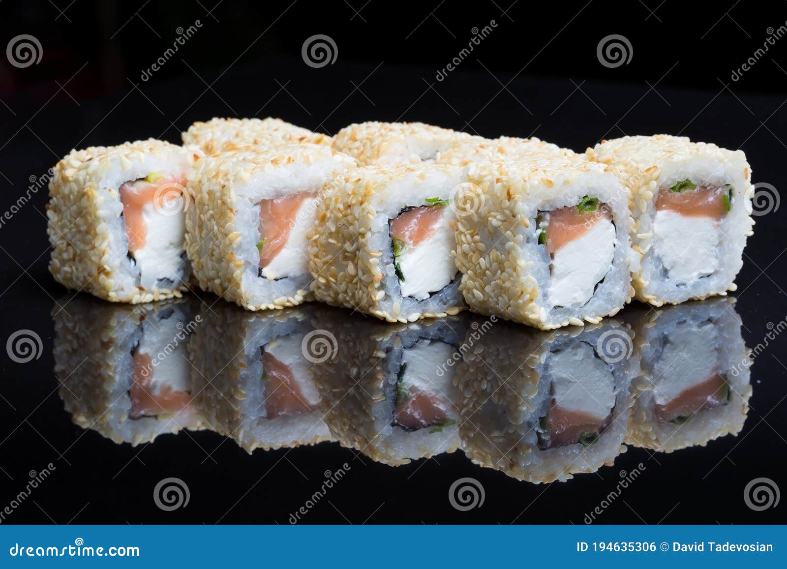 Sushi Rolls Shake Chizu with Sesame on a Black Background. Stock Photo ...