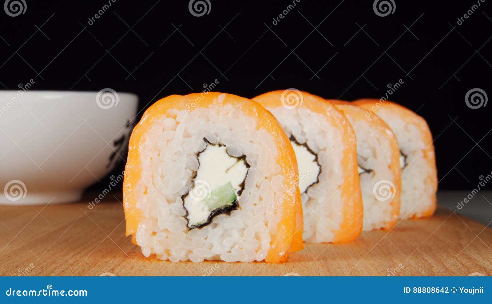 Sushi in a Row on a Wooden Plate Stock Photo - Image of meal ...