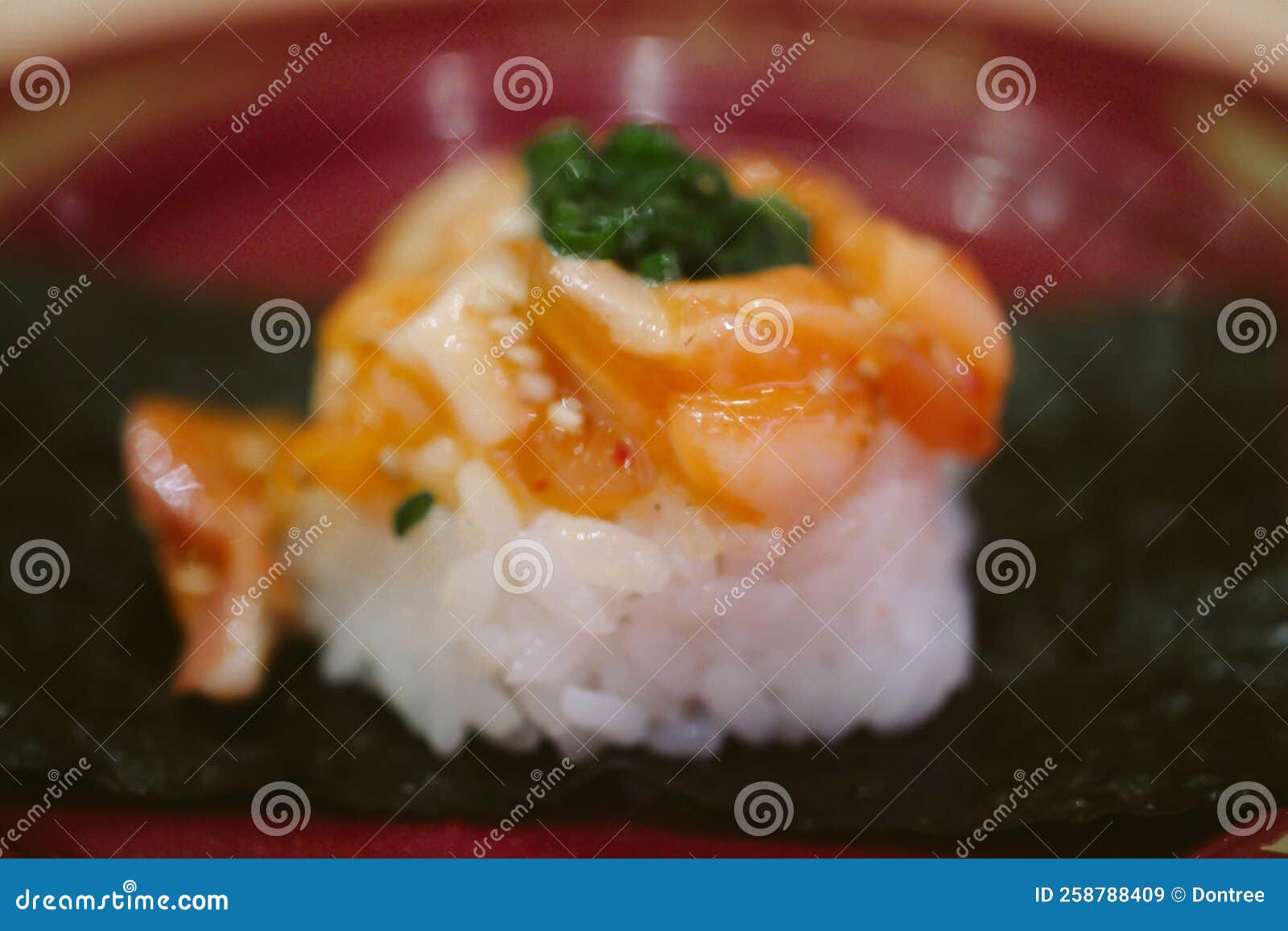 Sushi Salmon with Rice Placed on Seaweed Stock Image - Image of ...