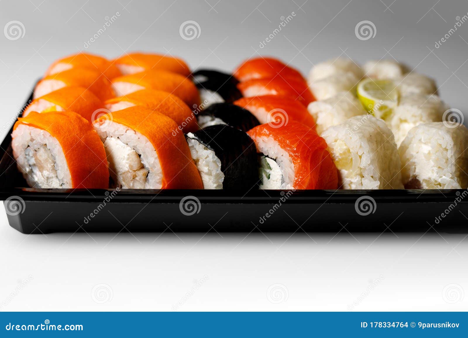 Sushi Set in a Plastic Container. Sushi Delivery Concept Stock Photo ...