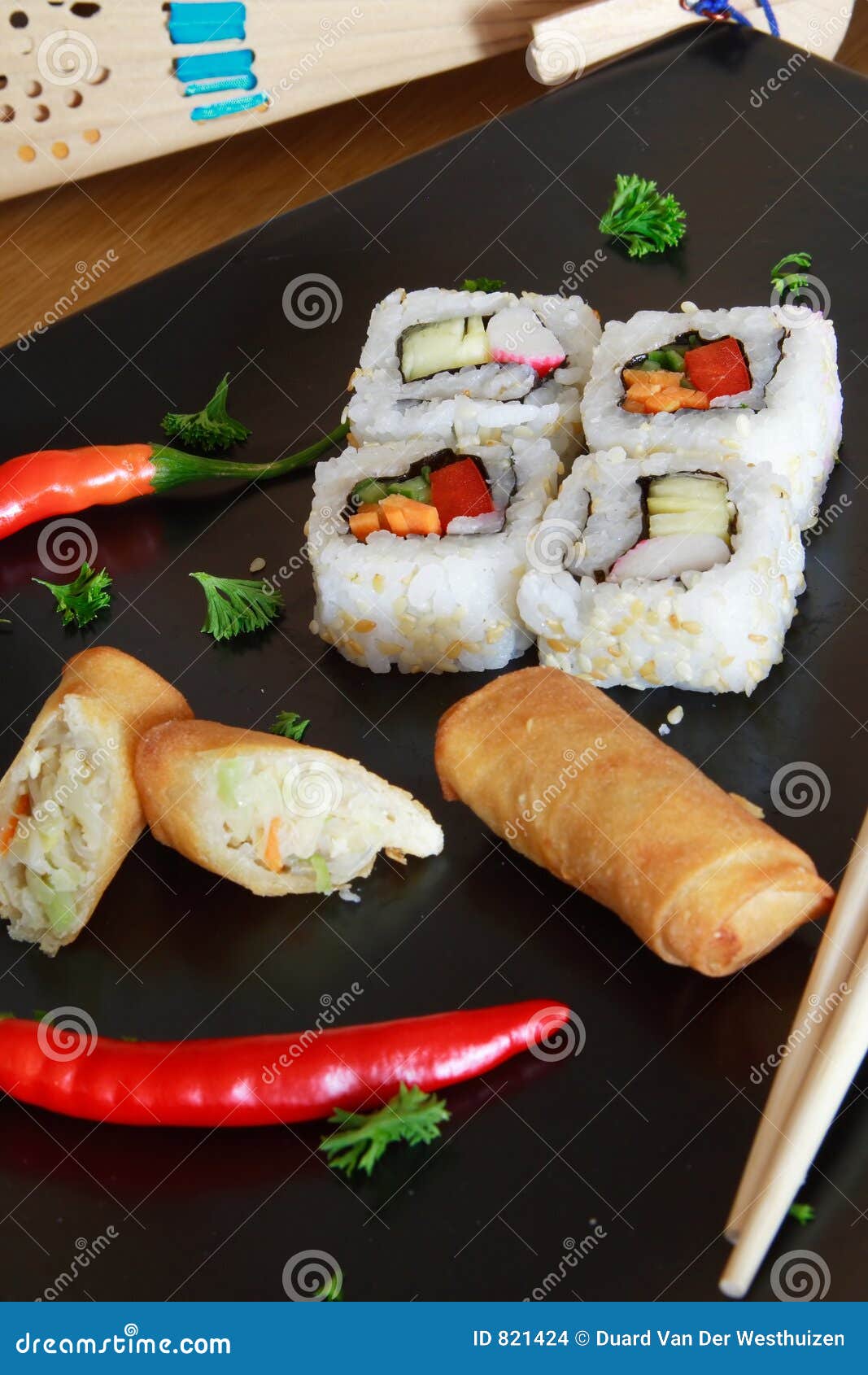 Sushi and spring rolls stock photo. Image of chilli, plate - 821424