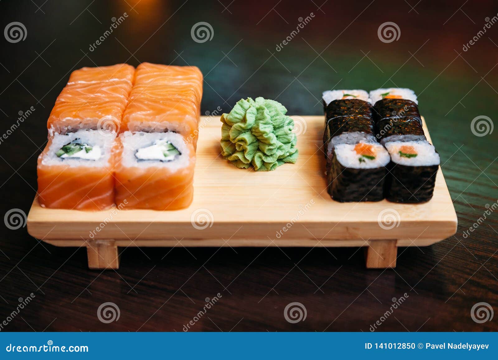 Sushi on wooden plate stock photo. Image of food, fish - 141012850