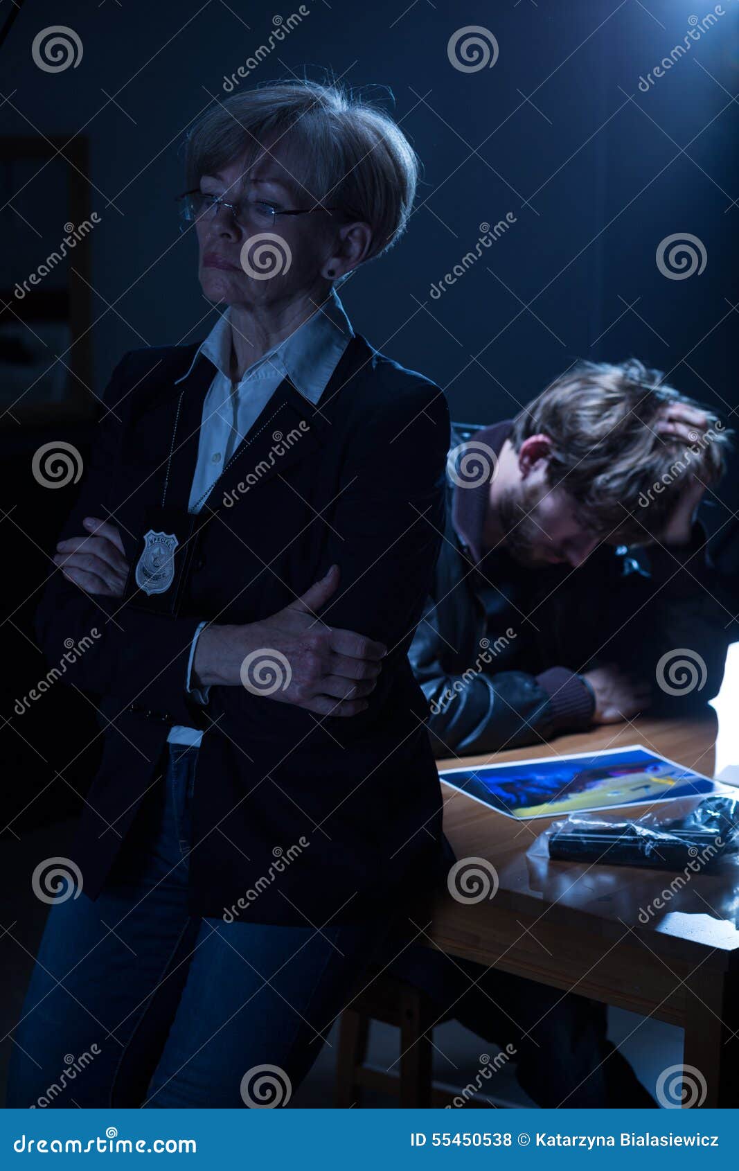 Suspect Man Looking at Picture Stock Photo - Image of people, interview ...