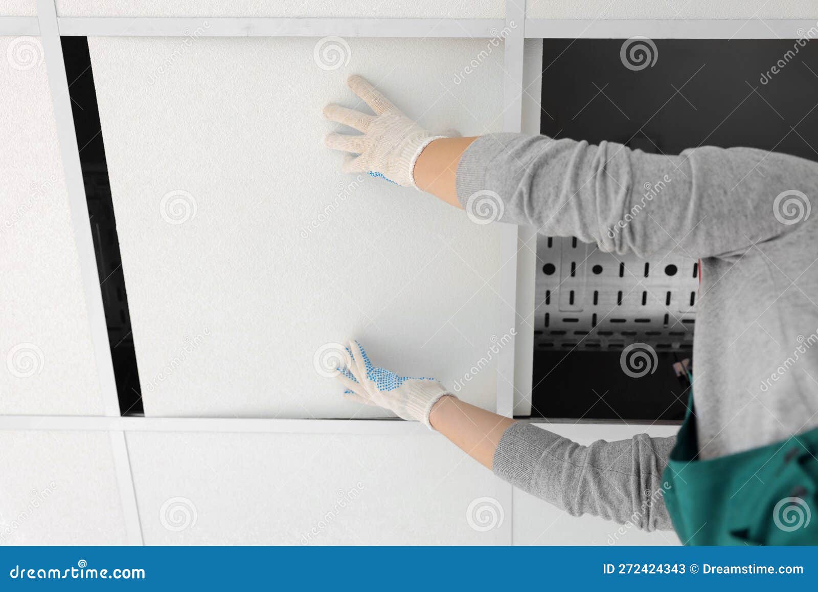 Suspended Ceiling Installation. Builder Working with PVC Tile, Bottom ...