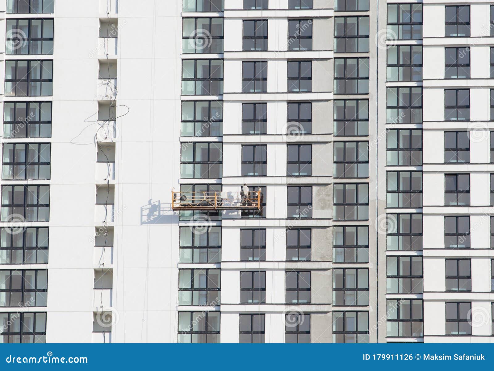 Suspended Cradle on the Facade of the Skyscraper. Mobile Scaffolding ...