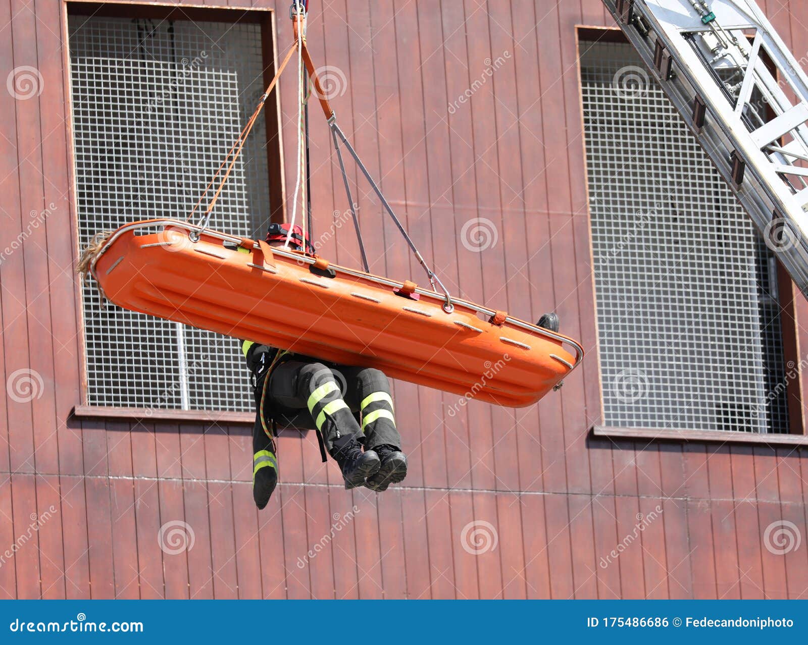 Suspended Firefighter with Stretcher with People during Practice Stock ...